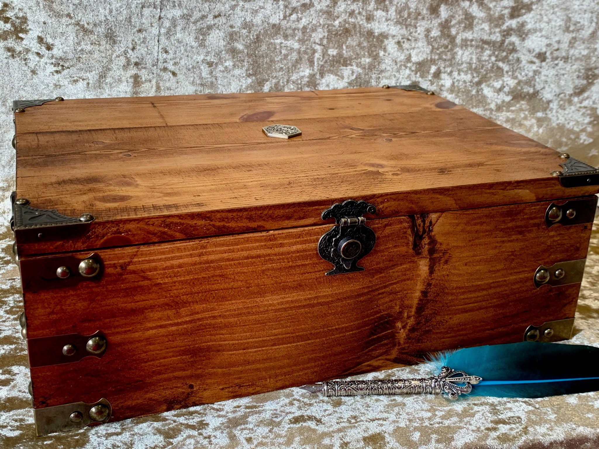 A dice chest featuring leather strap and embellishments, DnD Box.
